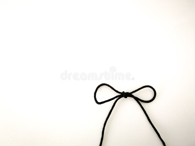 Black Rope with Ribbon Tie on White Background. Stock Photo - Image of ...