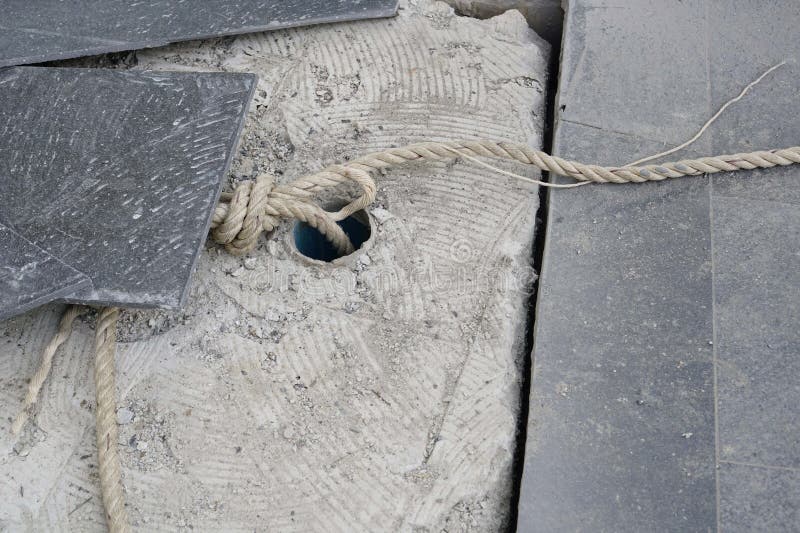 A Rope on a Cover Cement of a Drain a Construction Site for Open it ...