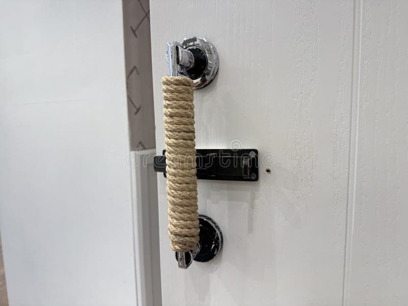 Rope on the old door stock photo. Image of nail, open - 124893706