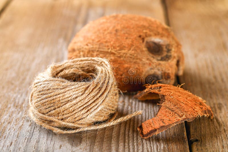 Rope of Fiber Coir and Coconut Shell on an Old Wooden Table. Stock ...