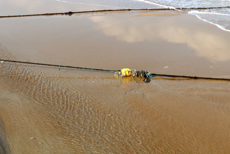 Rope with Floats on the Seashore Stock Image - Image of water, sand ...
