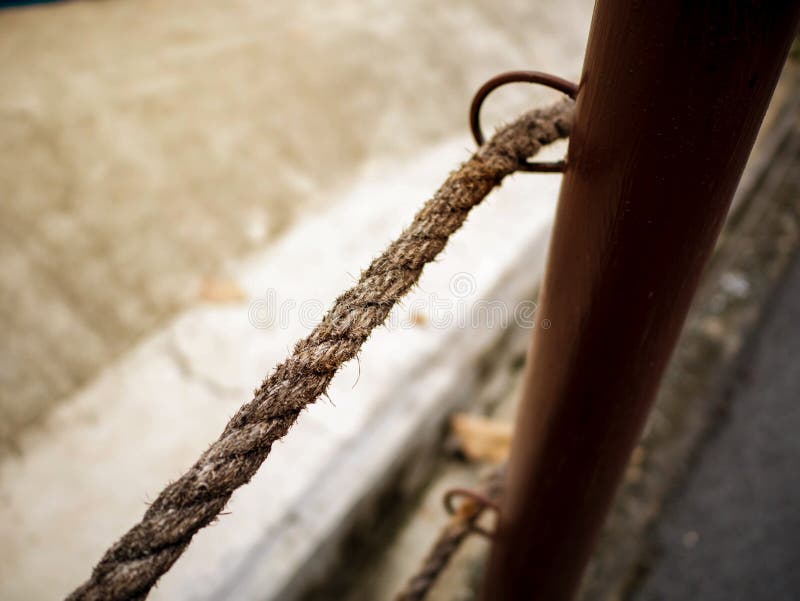 Rope hang on the iron pipe stock photo. Image of loop - 122593592