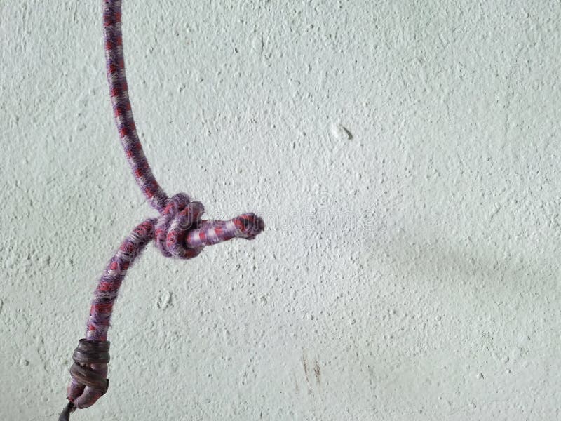 Rope Hanging Down There is a White Wall Behind. Stock Photo - Image of ...
