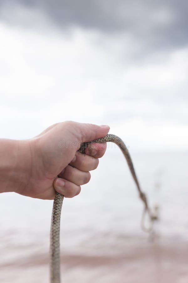 A Rope in His Hand on a Lake Stock Image - Image of rope, enjoying ...