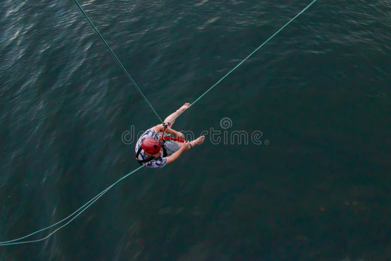 Rope Jumping from High Altitude of Bridge. Bungee Jumping from ...