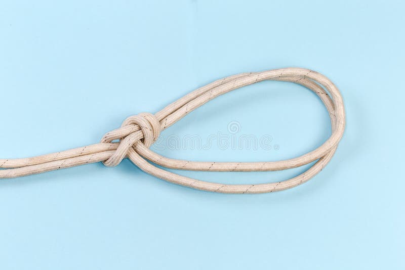 Rope Knot Bowline on a Bight on a Blue Background Stock Photo - Image ...