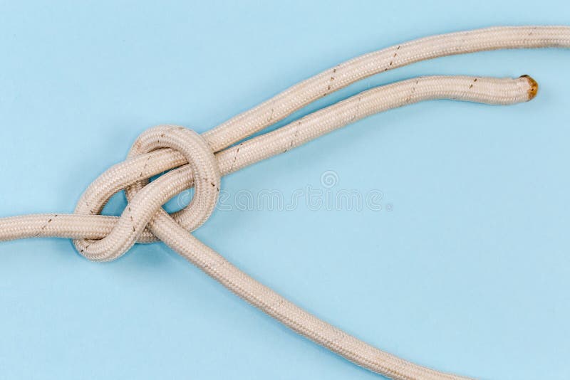 Rope Knot Bowline Close-up on a Blue Background Stock Photo - Image of ...