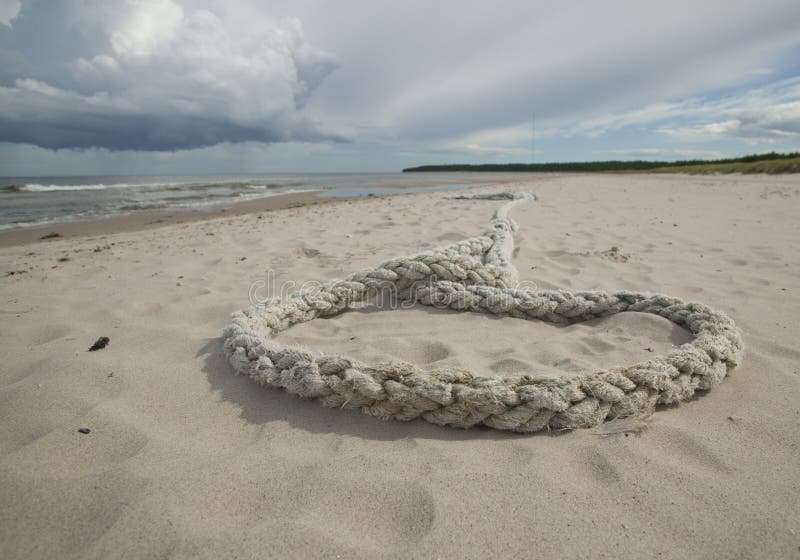 Rope laying in sand. GN stock photo. Image of shore, water - 36940766