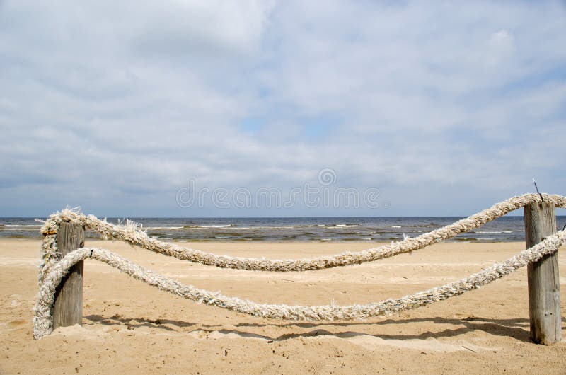 Rope log fence beach sand stock photo. Image of sand - 28903238