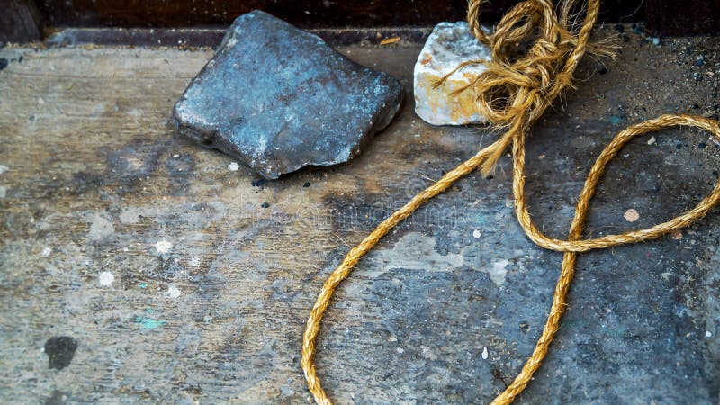 Rope Loop Stone on the Ground Stock Image - Image of protection, gold ...