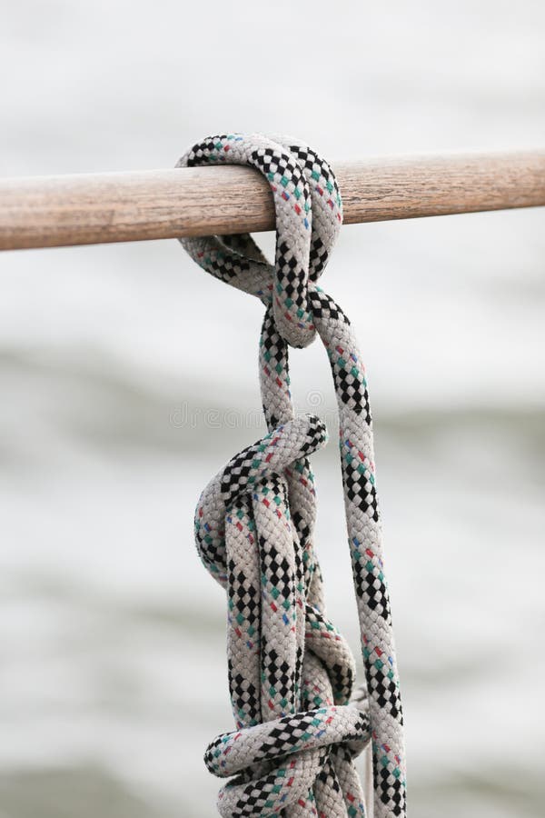 Rope on a railing stock photo. Image of knot, nautical - 361173912