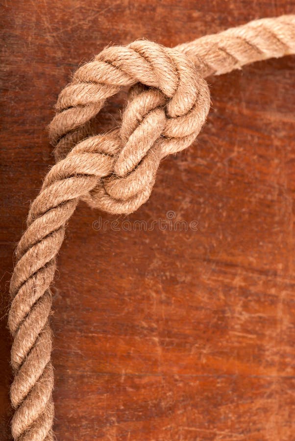 Rope with Reef Knot on Wood Texture Background Stock Photo - Image of ...