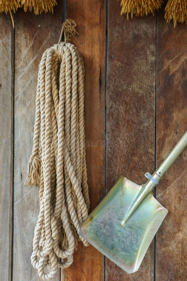 Rope and Shovel Hang on the Wooden Wall Stock Photo - Image of objects ...