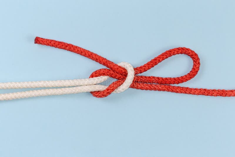 Rope Singly Slipped Reef Knot on a Blue Background Stock Photo - Image ...