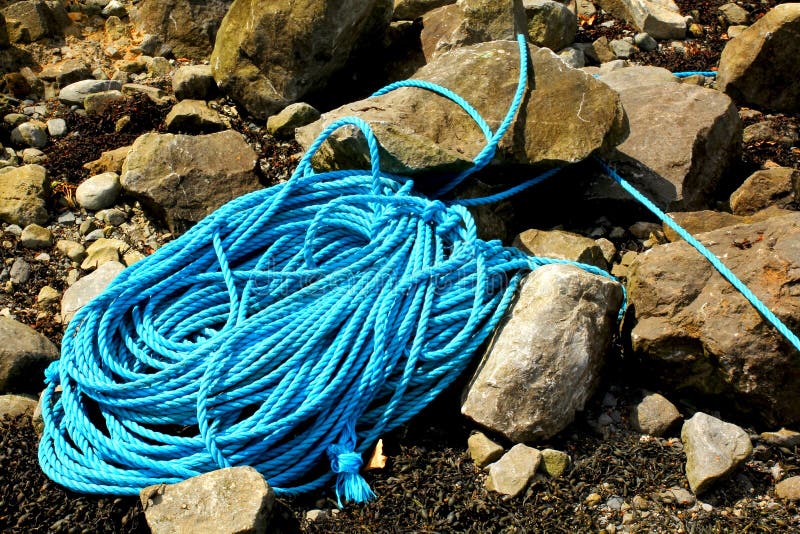 Rope between stones stock photo. Image of shaped, fishing - 41364190