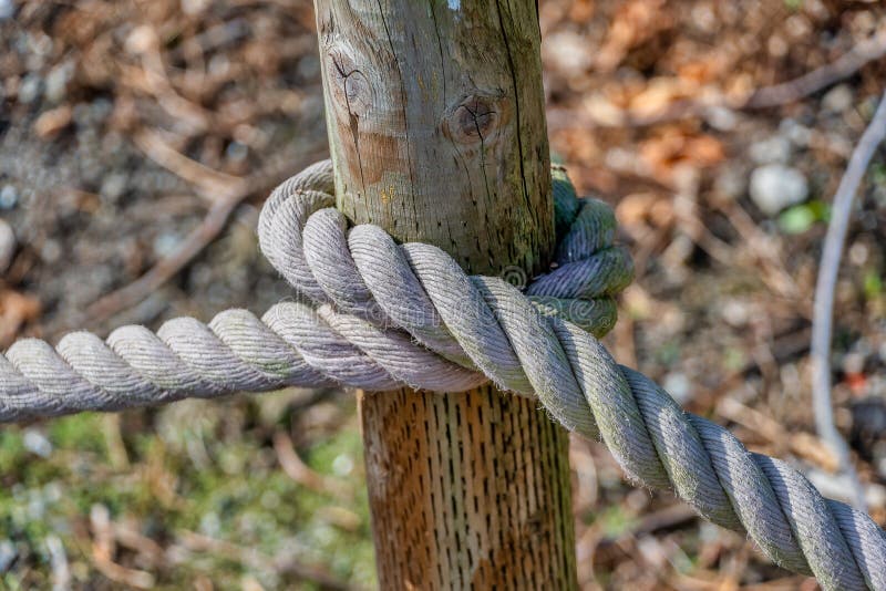 Rope tied around a pole stock photo. Image of material - 198068510