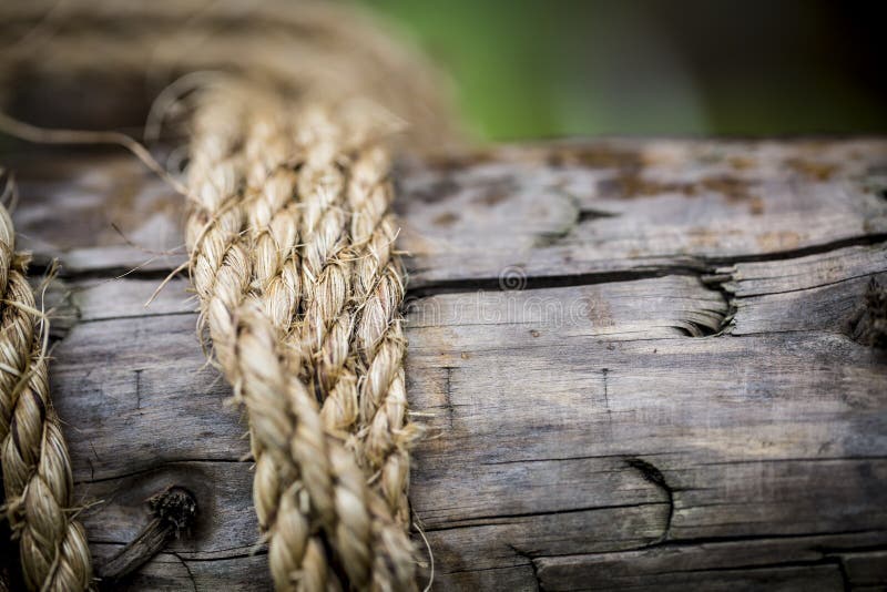 Rope tied around wood stock image. Image of knot, pattern - 195338735