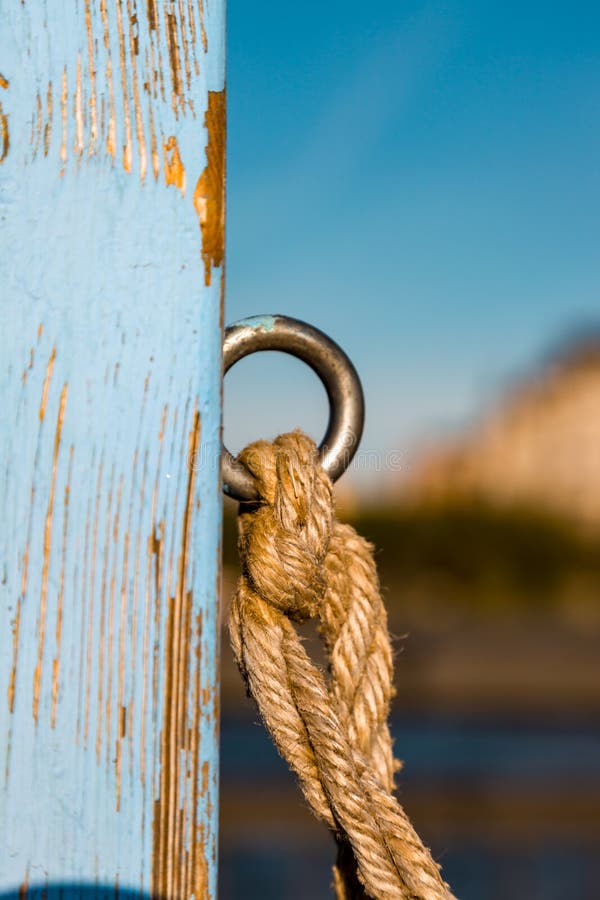 The Rope is Tied To the Iron Ring by a Sea Knot Stock Photo - Image of ...