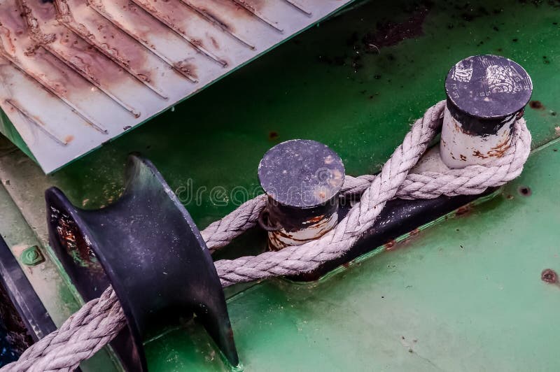 A Rope is Tied To Three Metal Posts Stock Image - Image of rusty, blue ...
