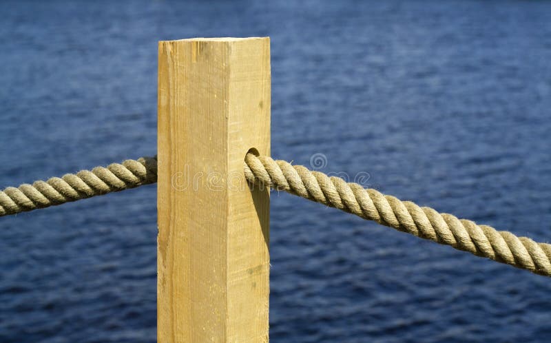 Rope through wooden pole stock photo. Image of outdoors - 191273006
