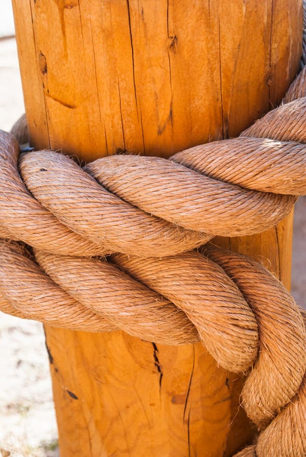 Rope on a wooden post stock photo. Image of ropes, wooden - 67069104