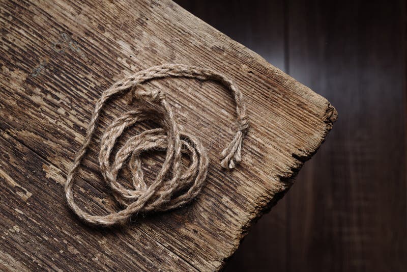 Rope on a wooden table stock photo. Image of decorative - 90965016