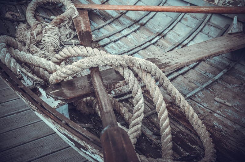 Ropes and oars in a boat stock image. Image of wooden - 105800955