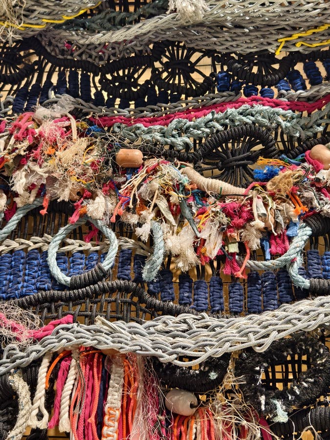 A Ropes Piece of Art is Displayed on a Wooden Wall Stock Image - Image ...