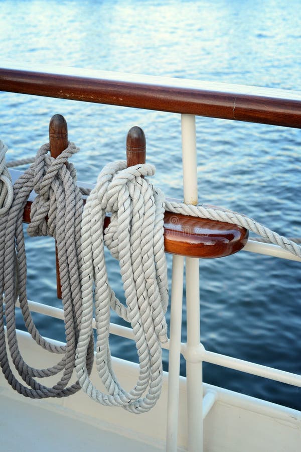 Ropes tied on a ship deck stock photo. Image of tall - 177312792