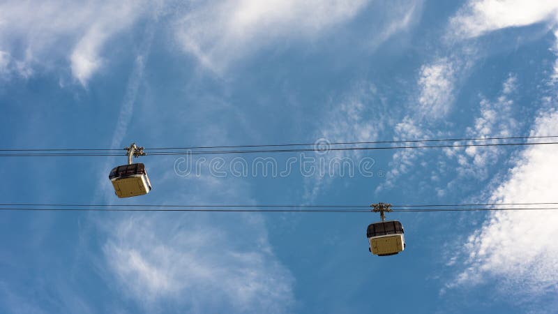 Ropeway with Wagons on a Background of Blue Sky with Clouds. Stock ...