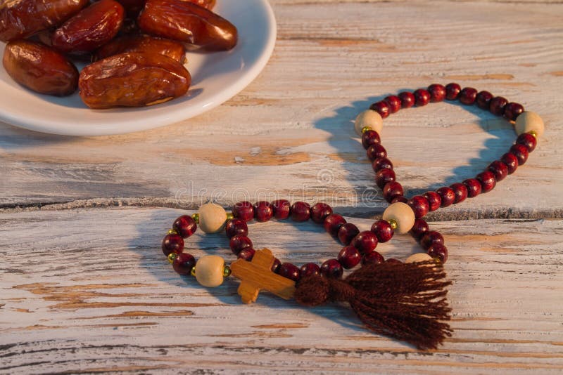 Rosary and Plate of Fruit Dates. Stock Photo - Image of fruit, holy ...