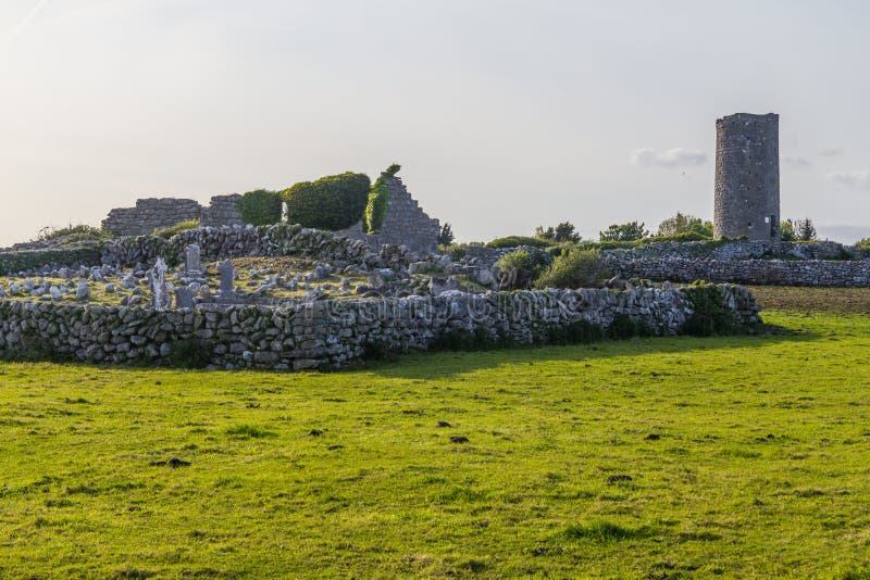 Roscam Round Tower in Galway Bay Stock Photo - Image of stone, cemetery ...