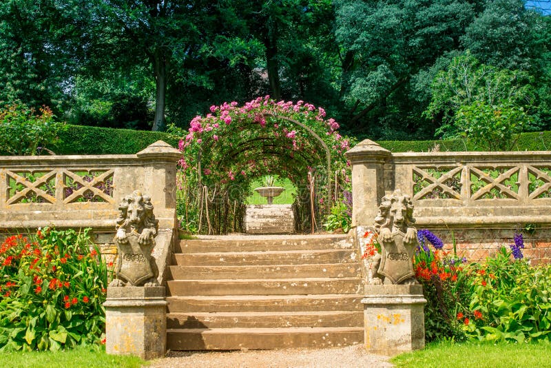 Rose Arch in the English Style Botanic Garden Stock Image - Image of ...