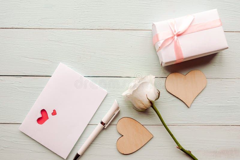 Rose, Gift Box and Card on the Table Stock Image - Image of text, pink ...