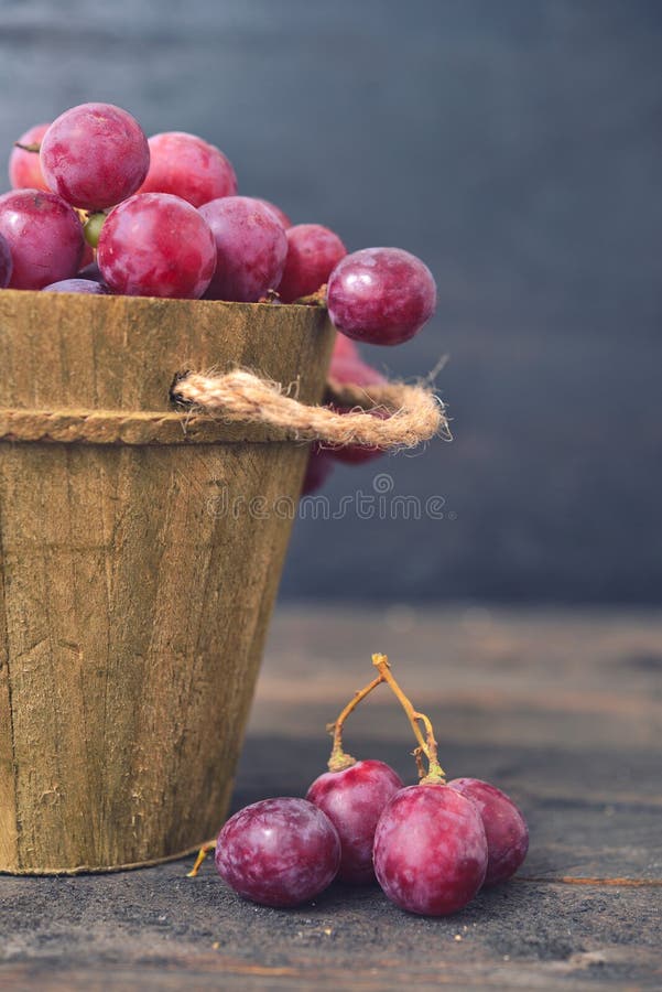 Rose Grapes in Wooden Bucket on a Woden Table Stock Image - Image of ...