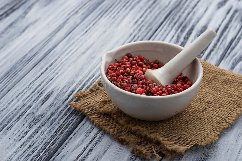 Rose pepper in mortar stock photo. Image of pounder, ingredient - 65865634