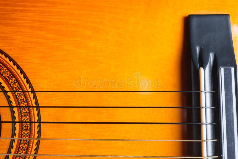 Rose, Strings and Bridge of a Yellow and Orange Guitar. Stock Photo ...