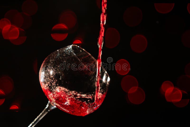 Red Wine Falling in a Way Splashing into a Wine Glass Stock Photo ...
