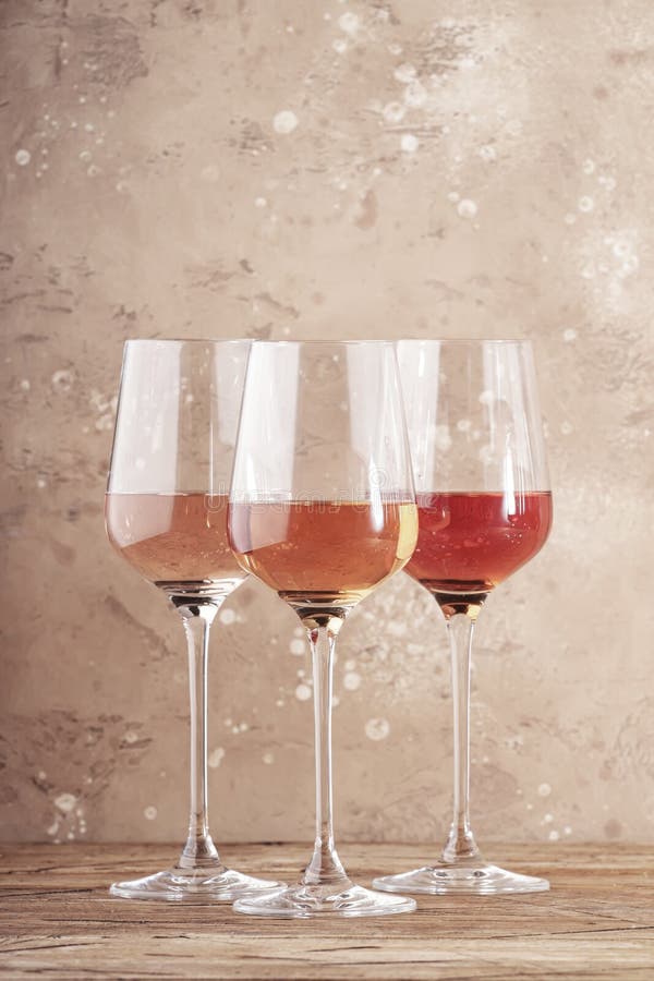 Rose Wine Glasses on the Beige Table. Rosado, Rosato or Blush Wine ...