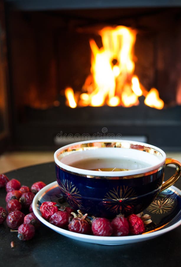 Rosehip Tea in Front of Roaring Fire in a Fire Place Stock Image ...