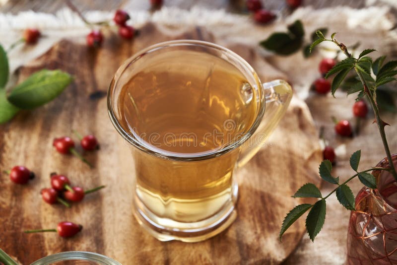 Rosehip Tea in a Glass Cup with Fresh Rose Hip Berries Stock Image ...