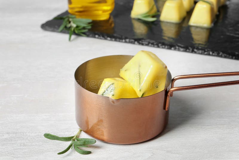 Rosemary and Olive Oil Ice Cubes in Saucepan Stock Photo - Image of ...