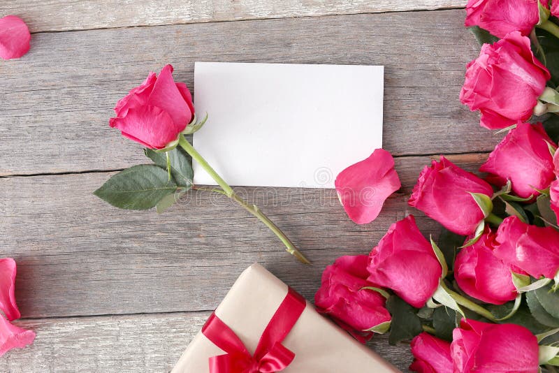 Roses and gift stock image. Image of bloom, seasonal - 66413595
