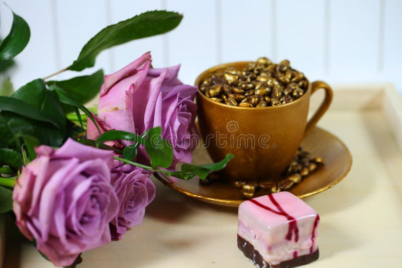 3 Roses with a Golden Coffee Cup Stock Image - Image of roses ...