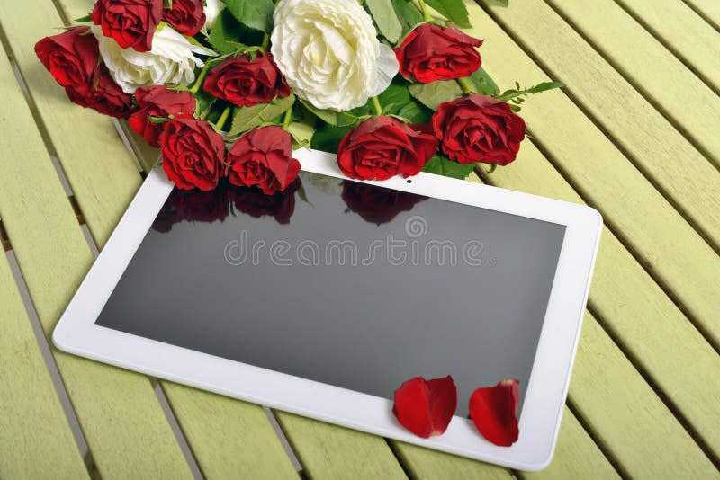 Roses and tablet stock photo. Image of festive, bouquet - 38642012