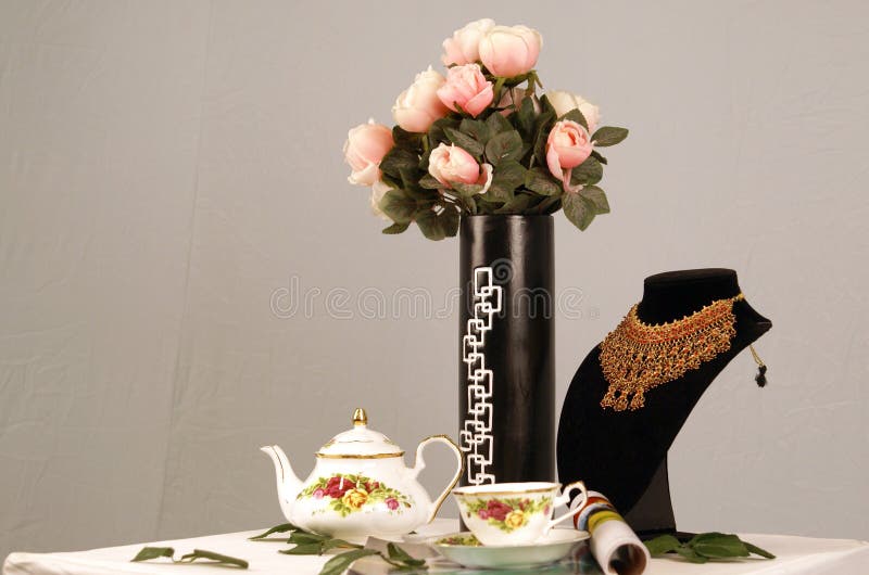 Roses and tea stock photo. Image of table, container, stem - 5567258