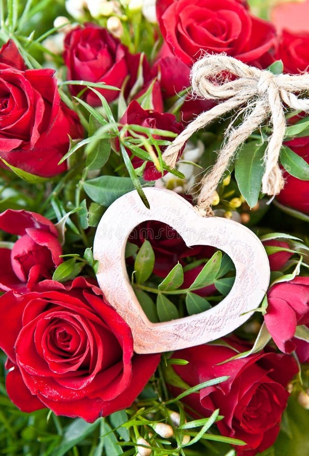 Roses with a wooden heart stock photo. Image of heart - 29221966