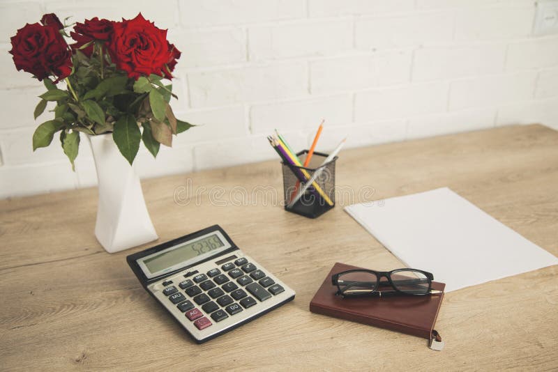 Roses with working desk stock image. Image of flower - 176587175