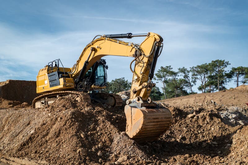 Rotary Backhoe Excavating the Earth Stock Photo - Image of structure ...