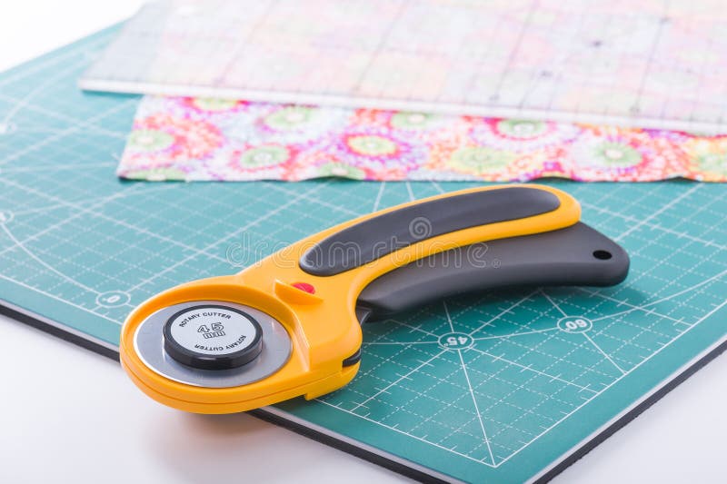 Rotary Cutter on a Green Mat Stock Photo - Image of quilting, equipment ...